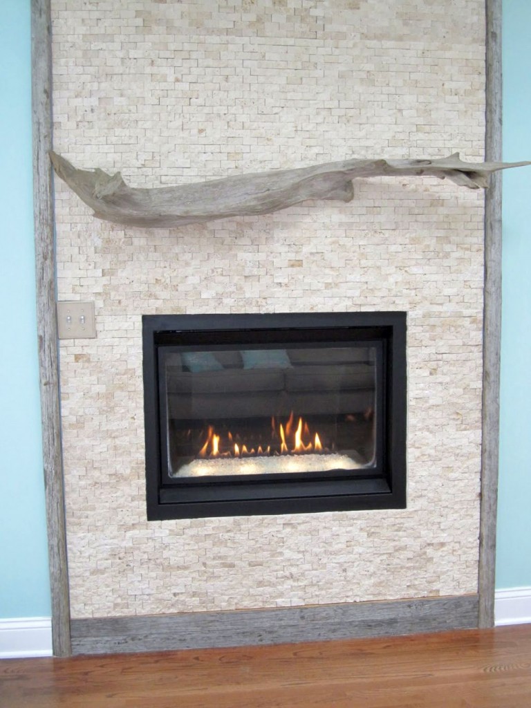 modern fireplace designs with glass on blue wall